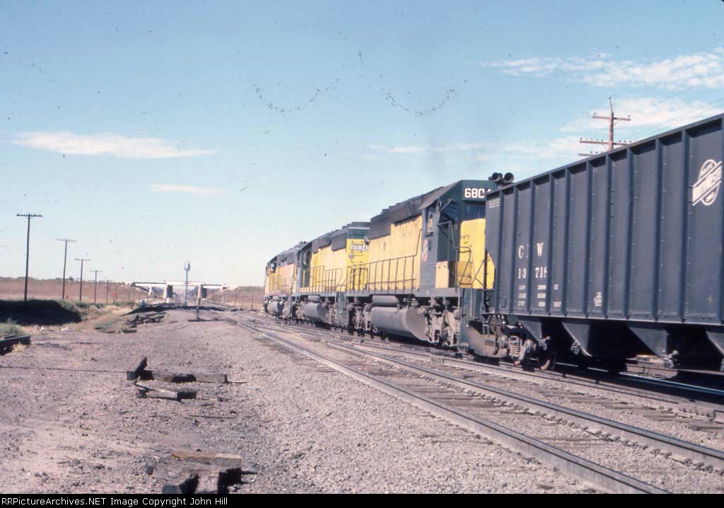 1091-27 Westbound UP freight passes under BN bridge